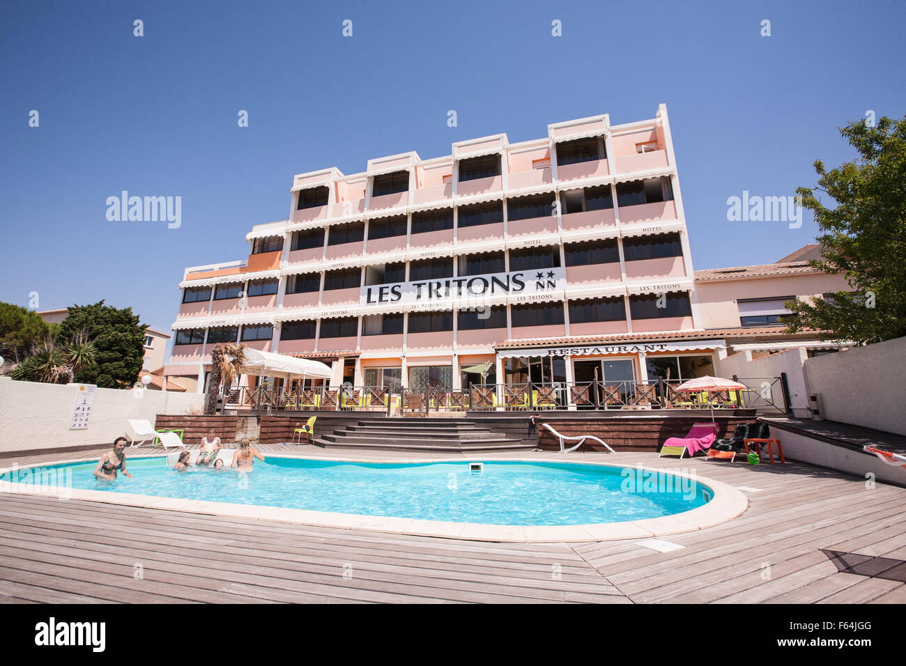 Relaxing at swimming pool at hotel. Sete,South,France,coast,holiday ...
