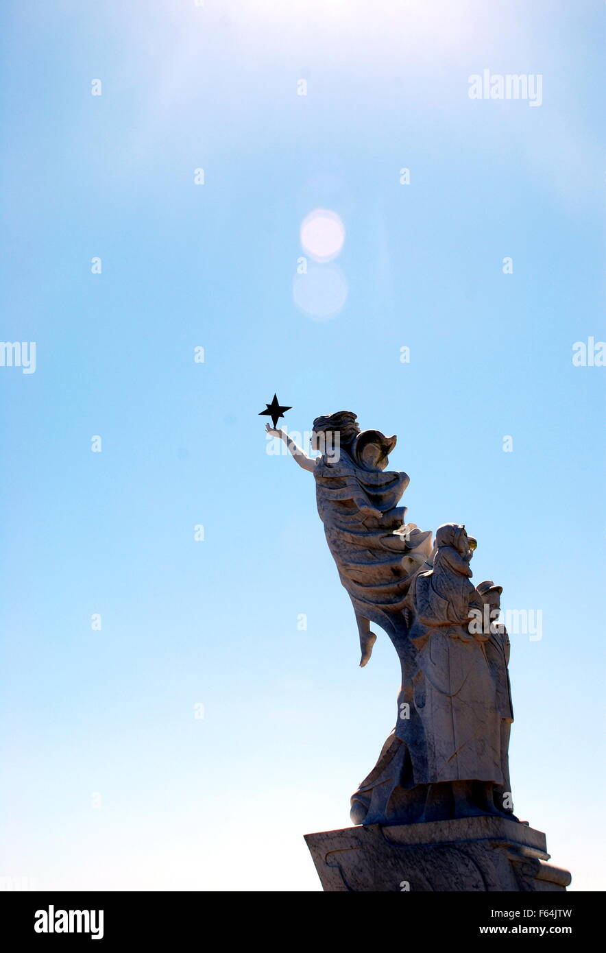 Statue With Sun Stock Photo - Alamy