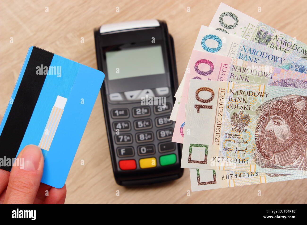 Polish currency money and credit card with payment terminal in ...