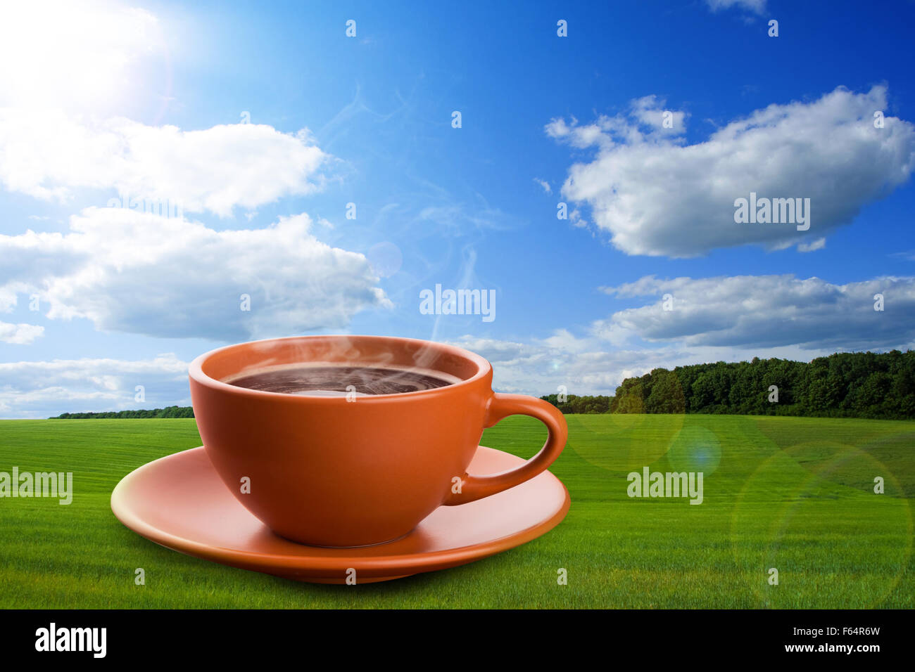Cup of hot bevarage against beautiful nature Stock Photo - Alamy