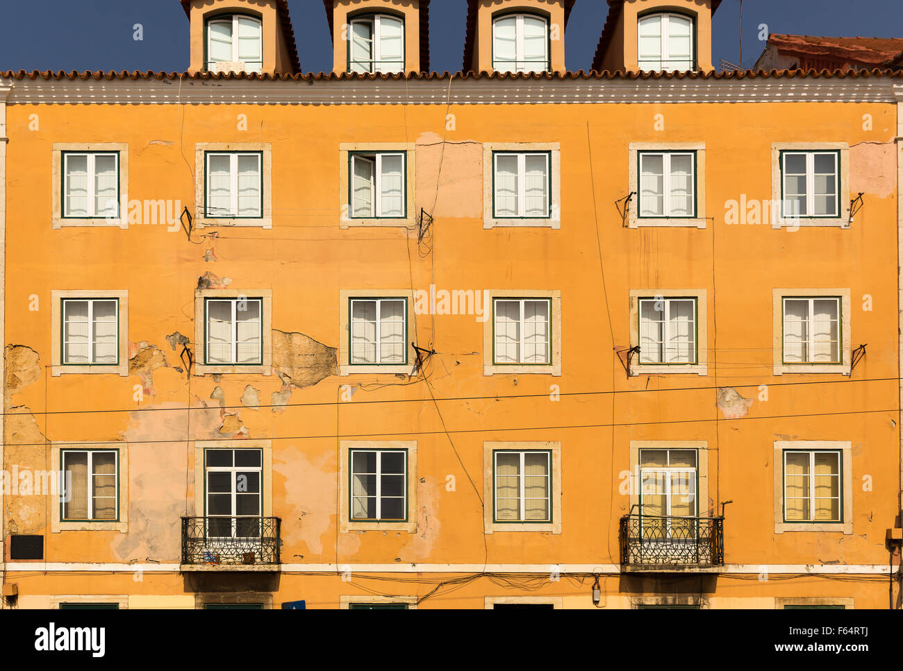 Old building wall with windows and balconies Stock Photo - Alamy