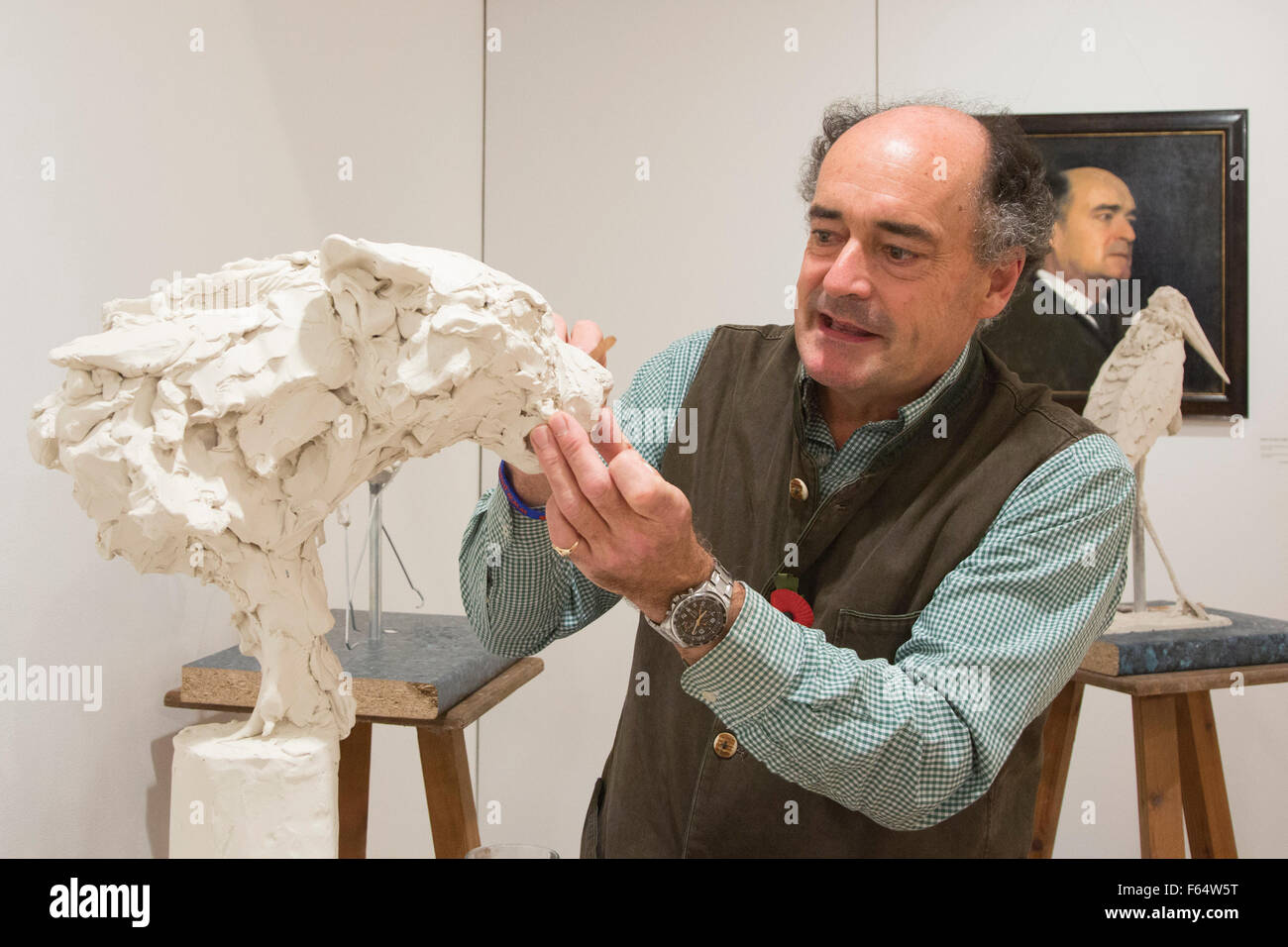 London, UK. 11 November 2015. Pictured: artist Mark Coreth works on a ...
