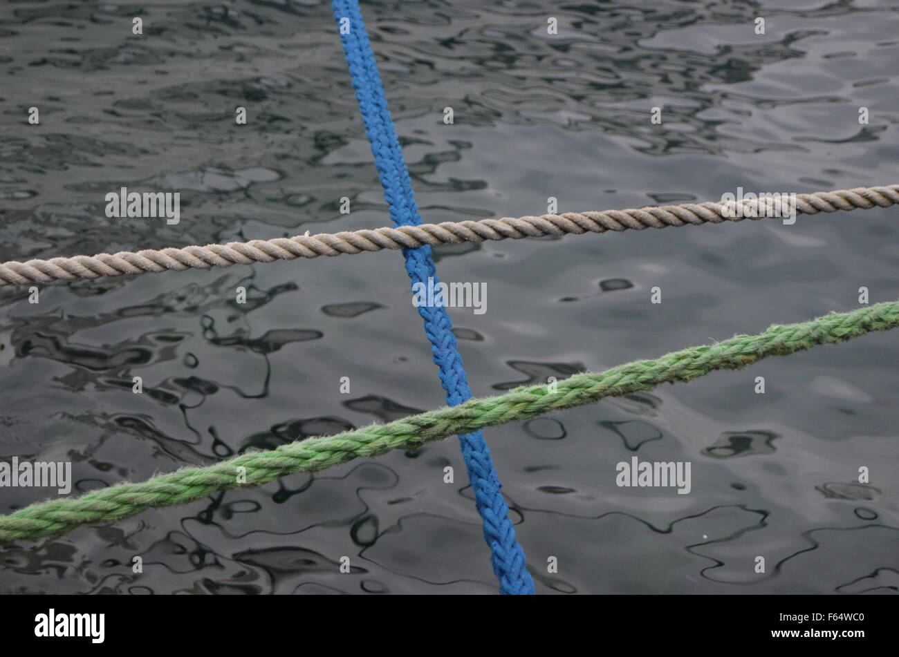 Blue green and white ship chandler intersecting above the sea Stock ...