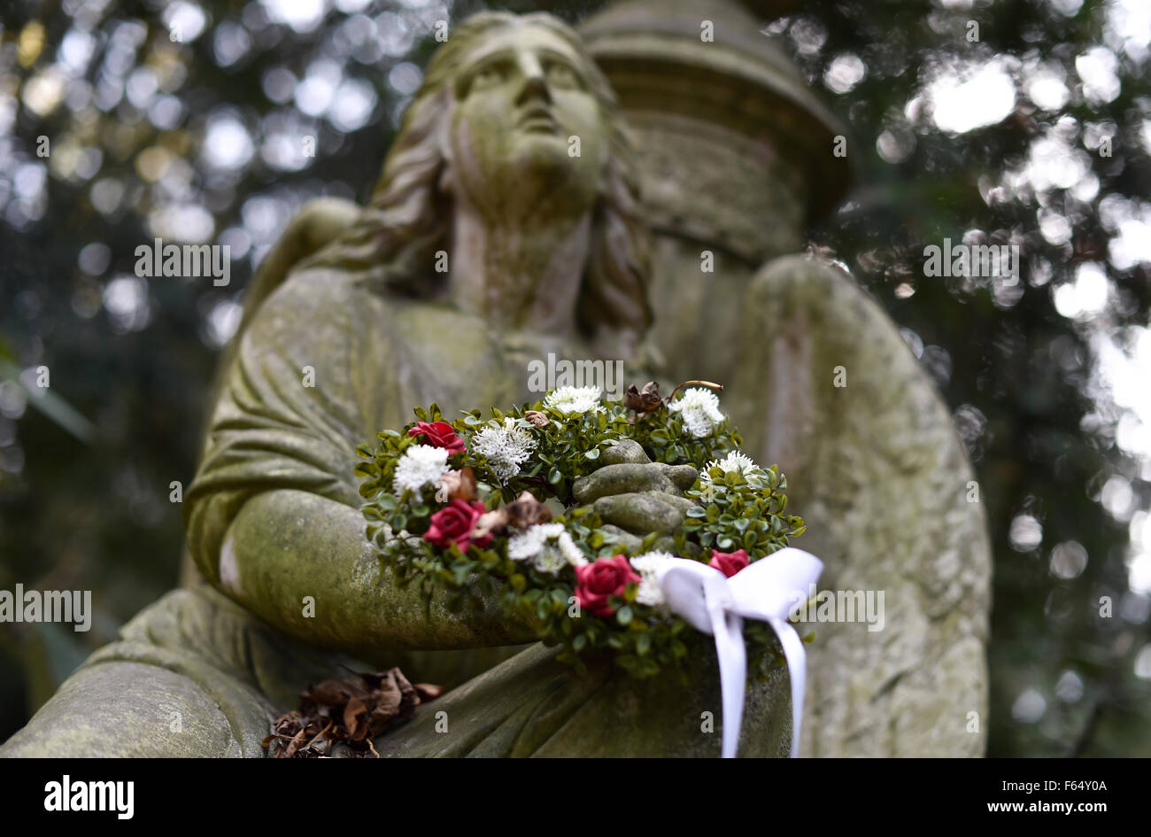 A grieving angel with a floral wreath adorns a grave in the Main ...