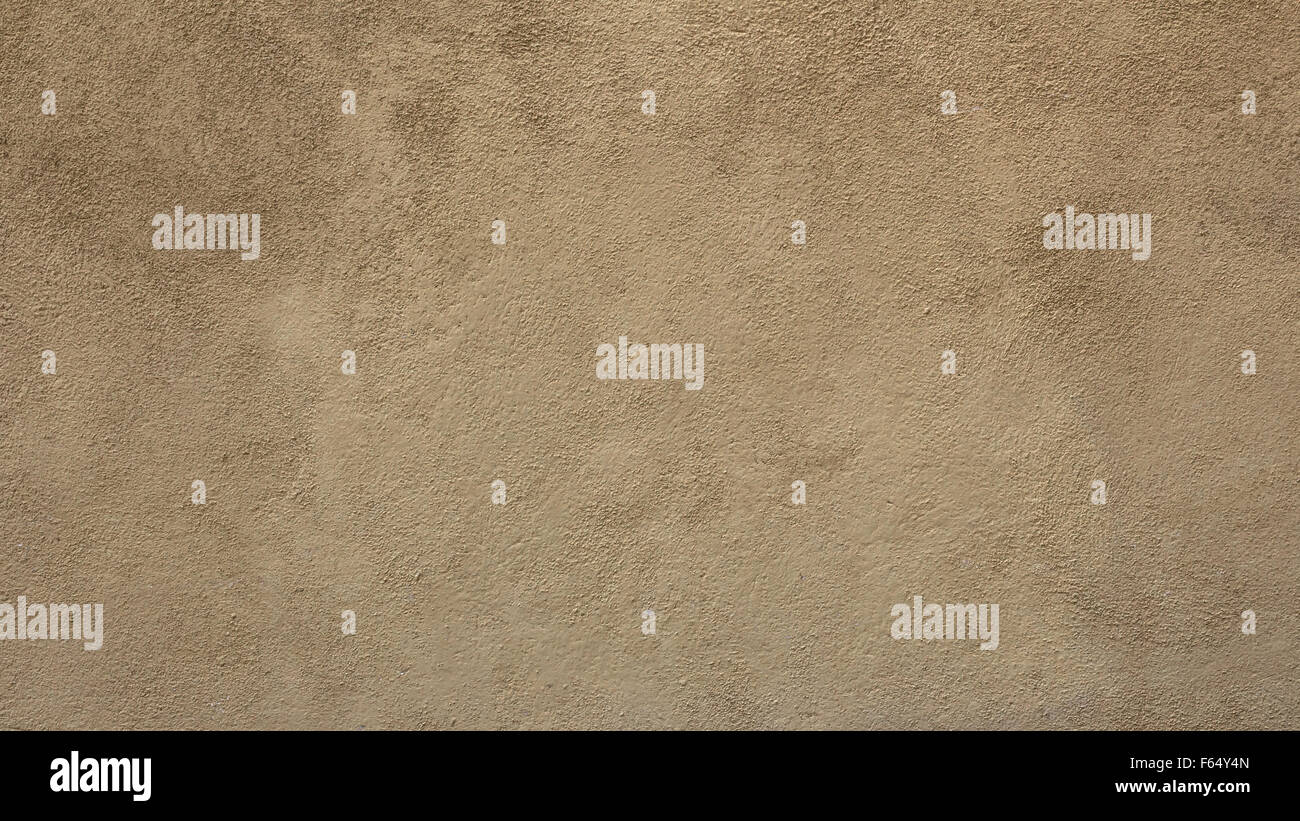Front view of a wall characterized by rough plaster, sand-colored Stock ...