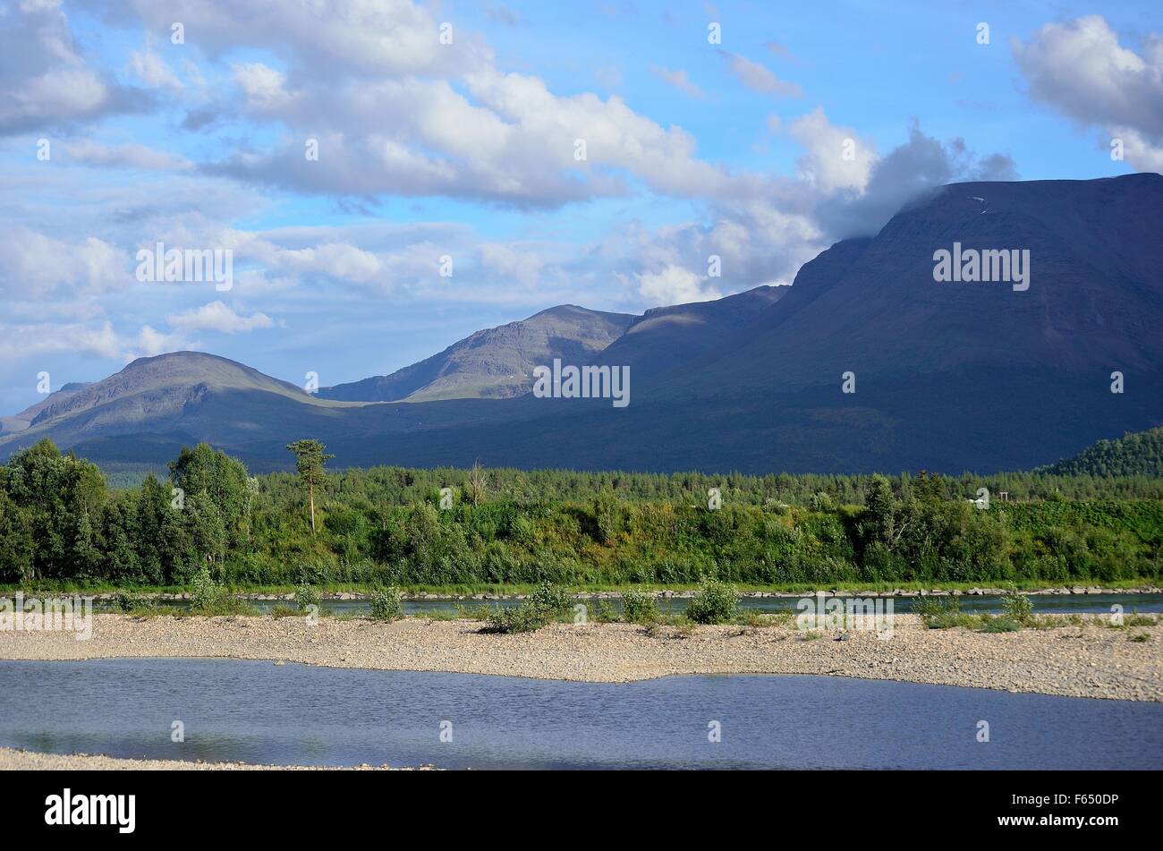 mighty river and mountain landscape with blue sky with clouds and green ...