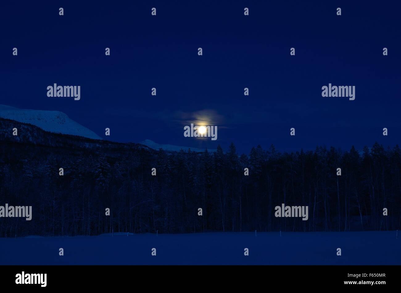 full moon over cold winter landscape in the arctic circle night Stock ...