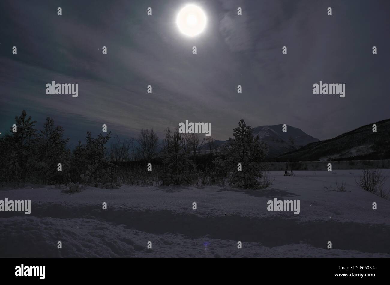 full moon over cold winter landscape in the arctic circle night Stock ...