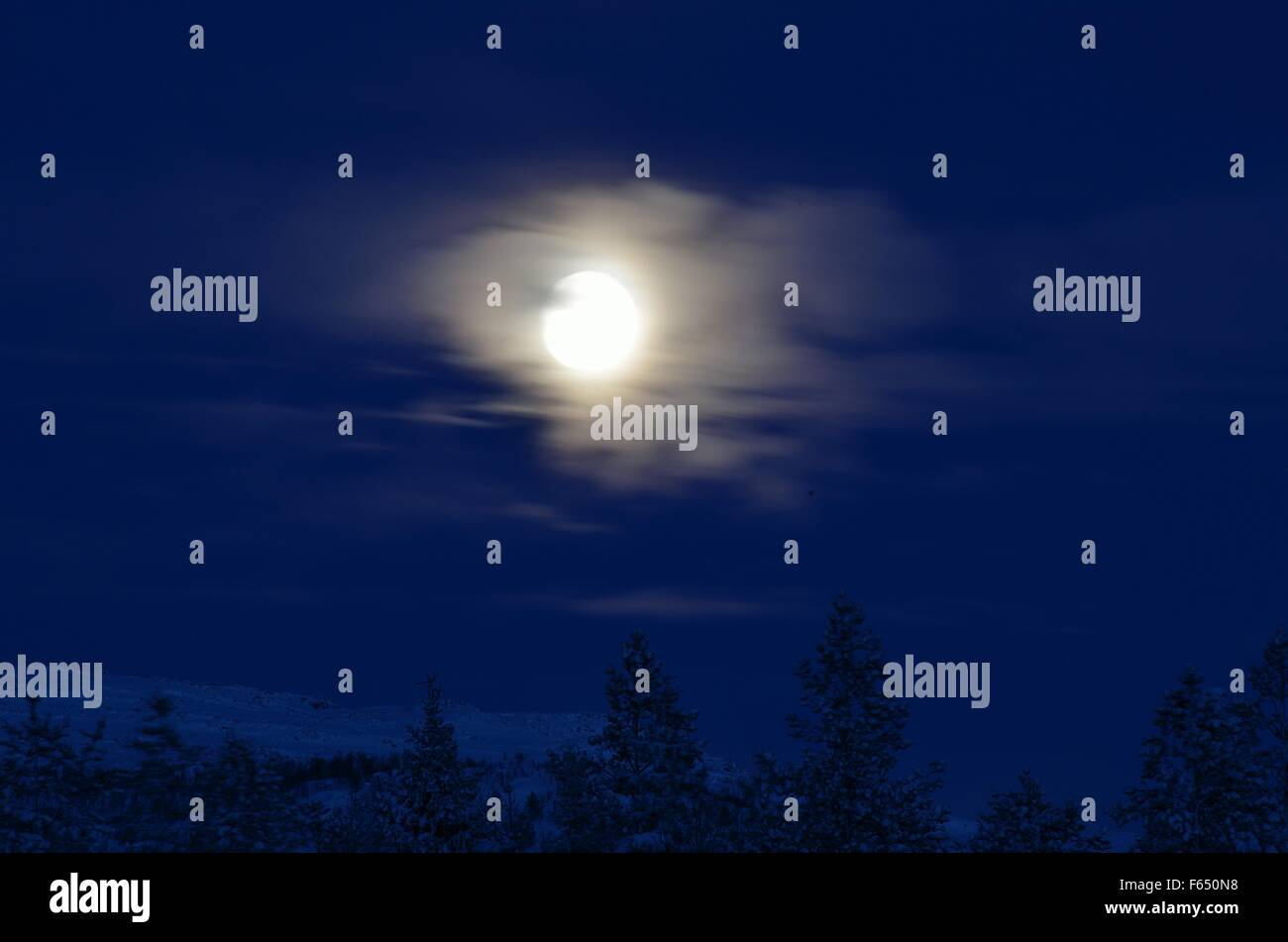 full moon over cold winter landscape in the arctic circle night Stock ...