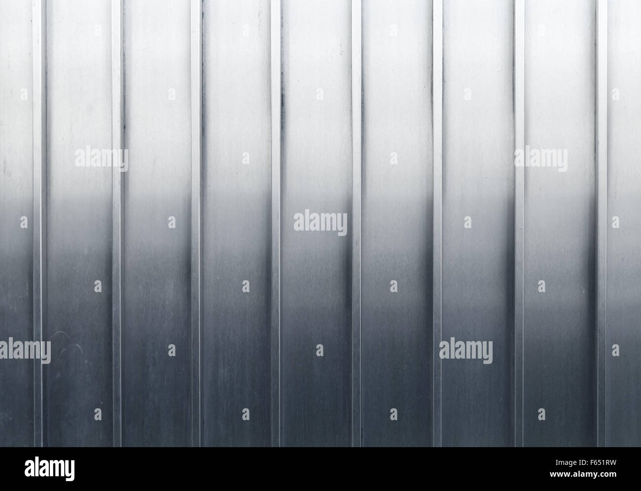 Shining metal wall with stiffening structure lines relief, background ...