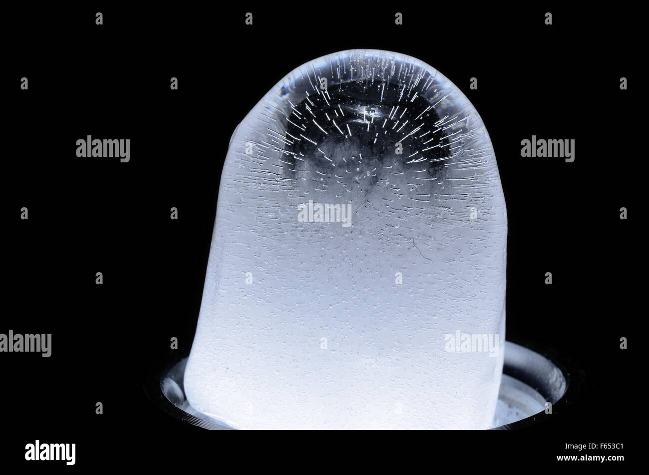 illuminated ice cube with air bubbles Stock Photo - Alamy