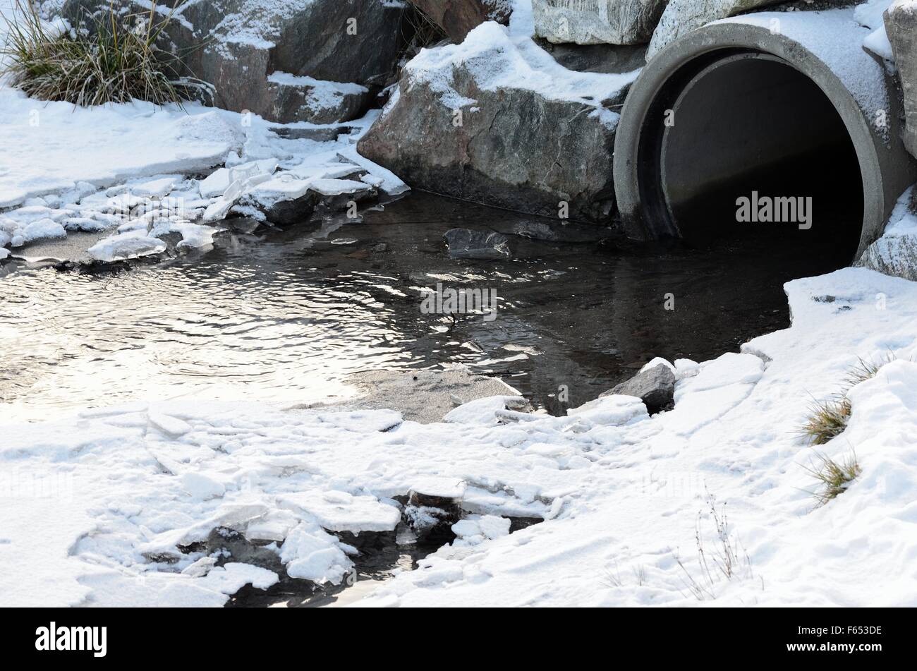 concrete water drain pipe and channel in winter snow Stock Photo - Alamy