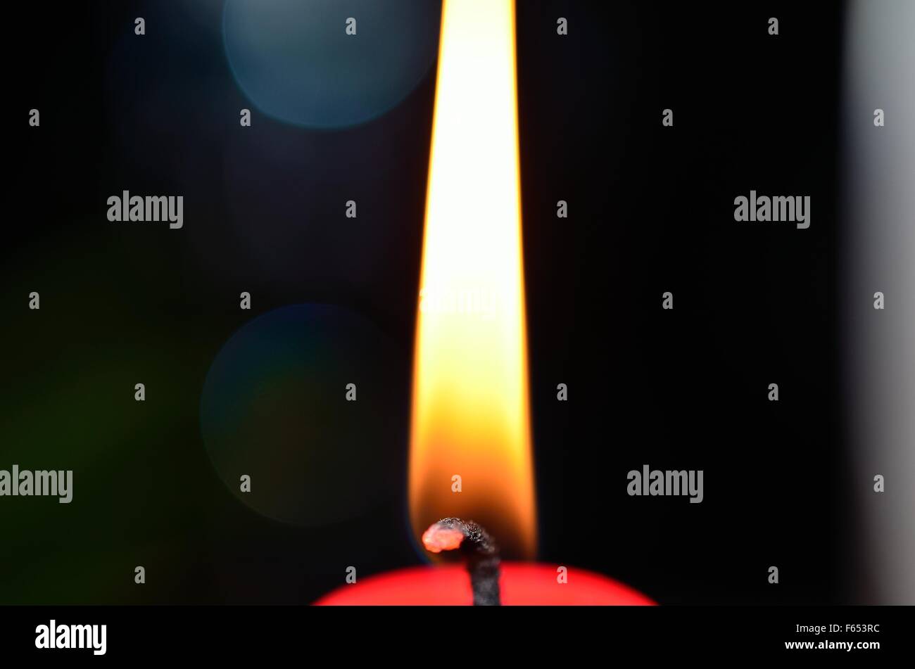 red candle light flame macro photo Stock Photo - Alamy