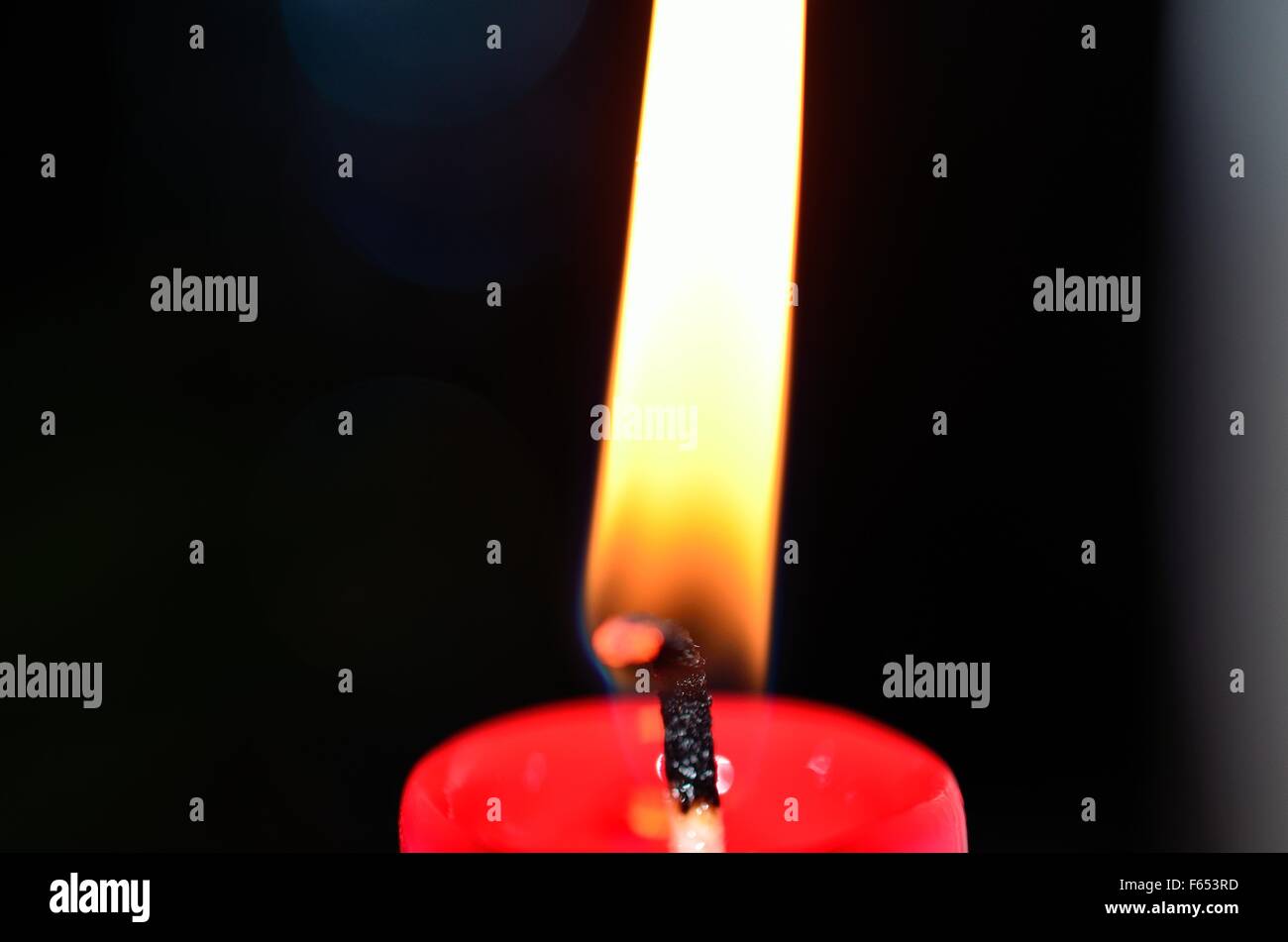 red candle light flame macro photo Stock Photo - Alamy
