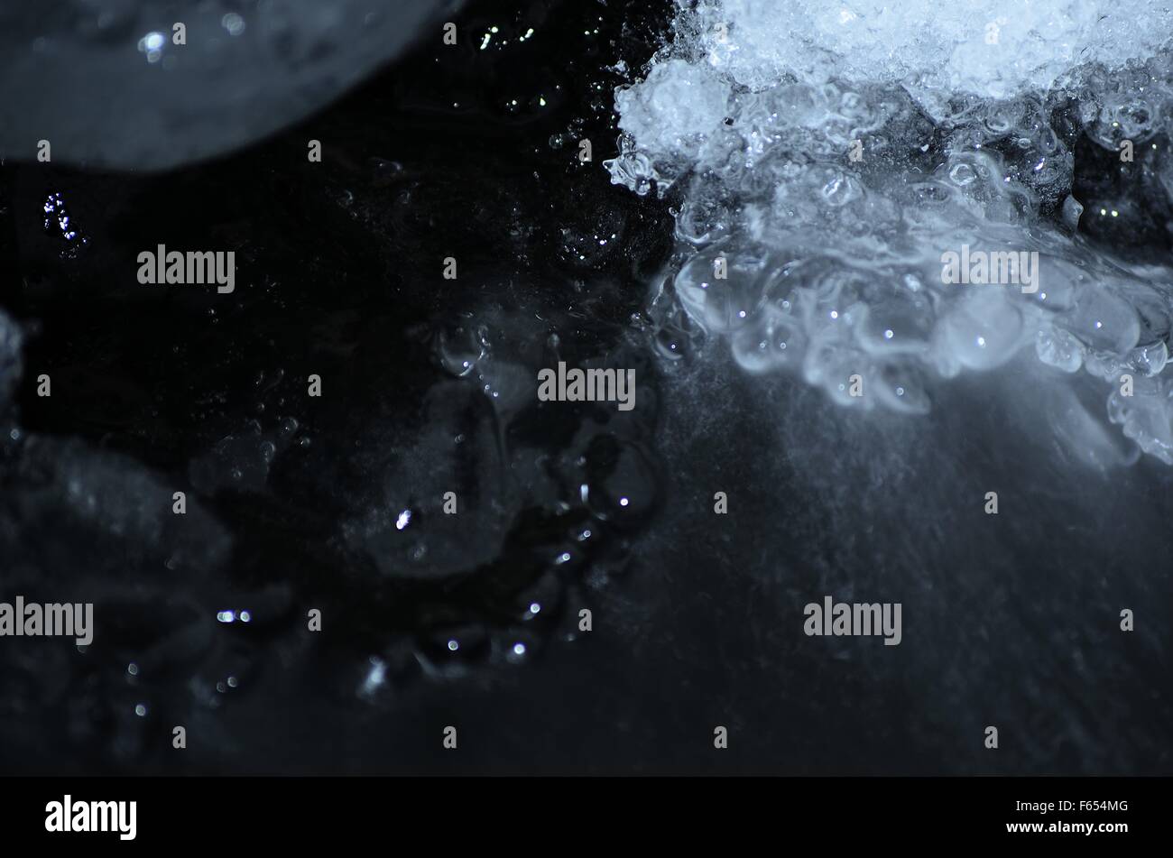 frozen ice shapes and river water flow in winter macro photo Stock ...