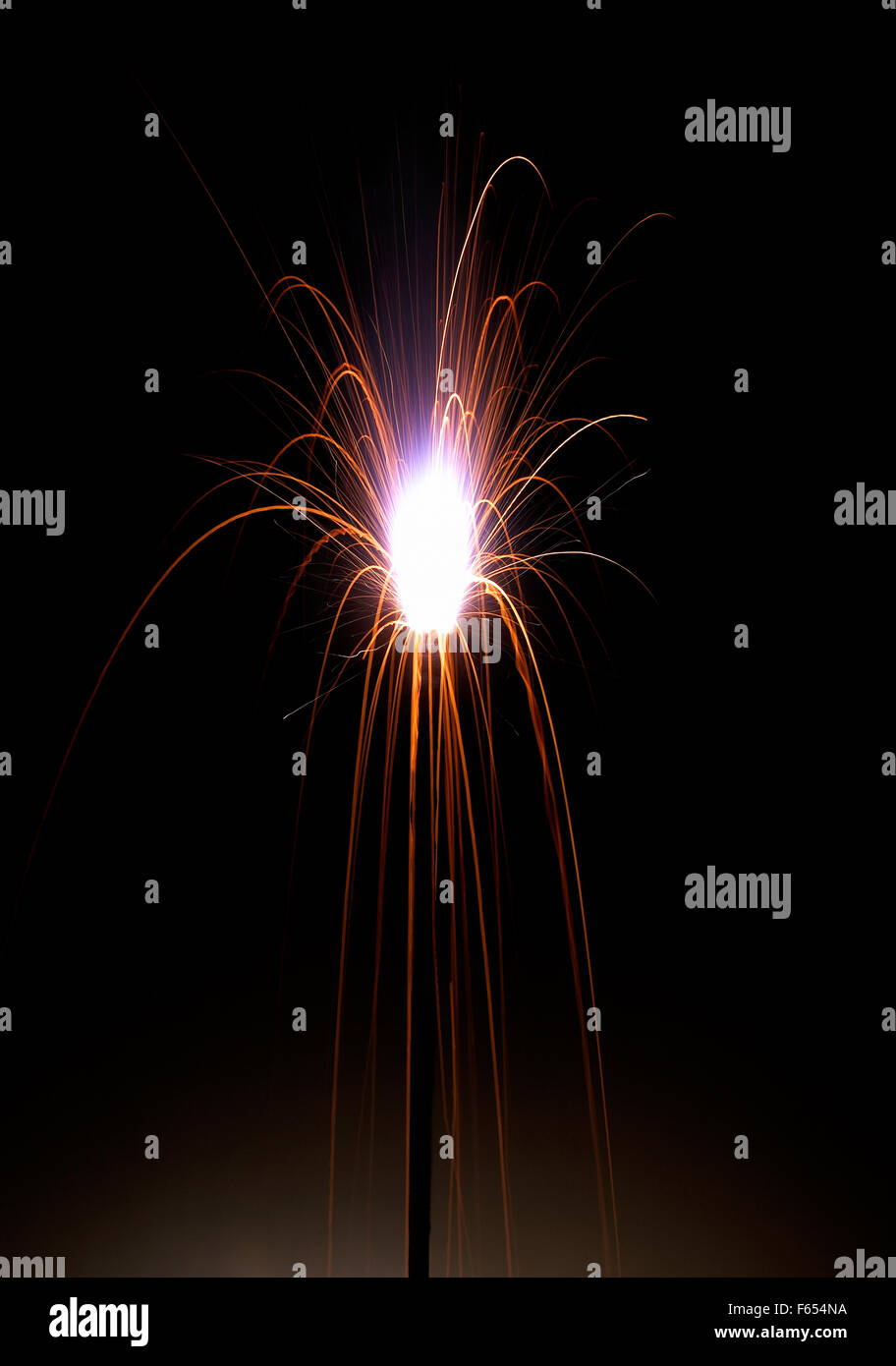 sparkler lit on black background Stock Photo - Alamy