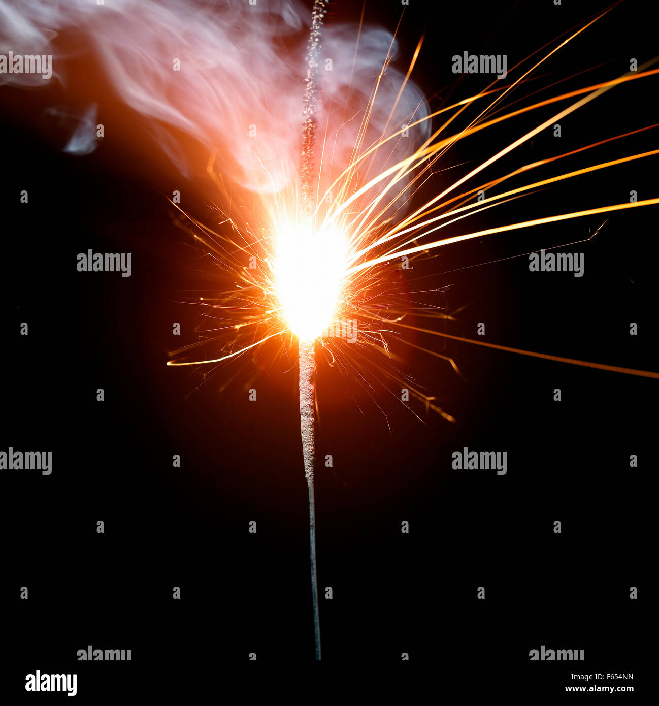 sparkler lit on black background Stock Photo - Alamy
