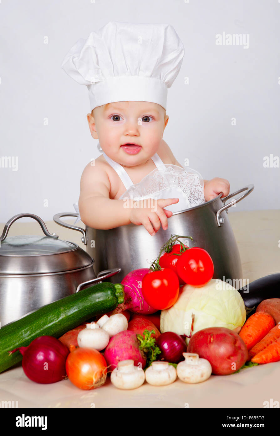 Baby cook in saucepan Stock Photo - Alamy