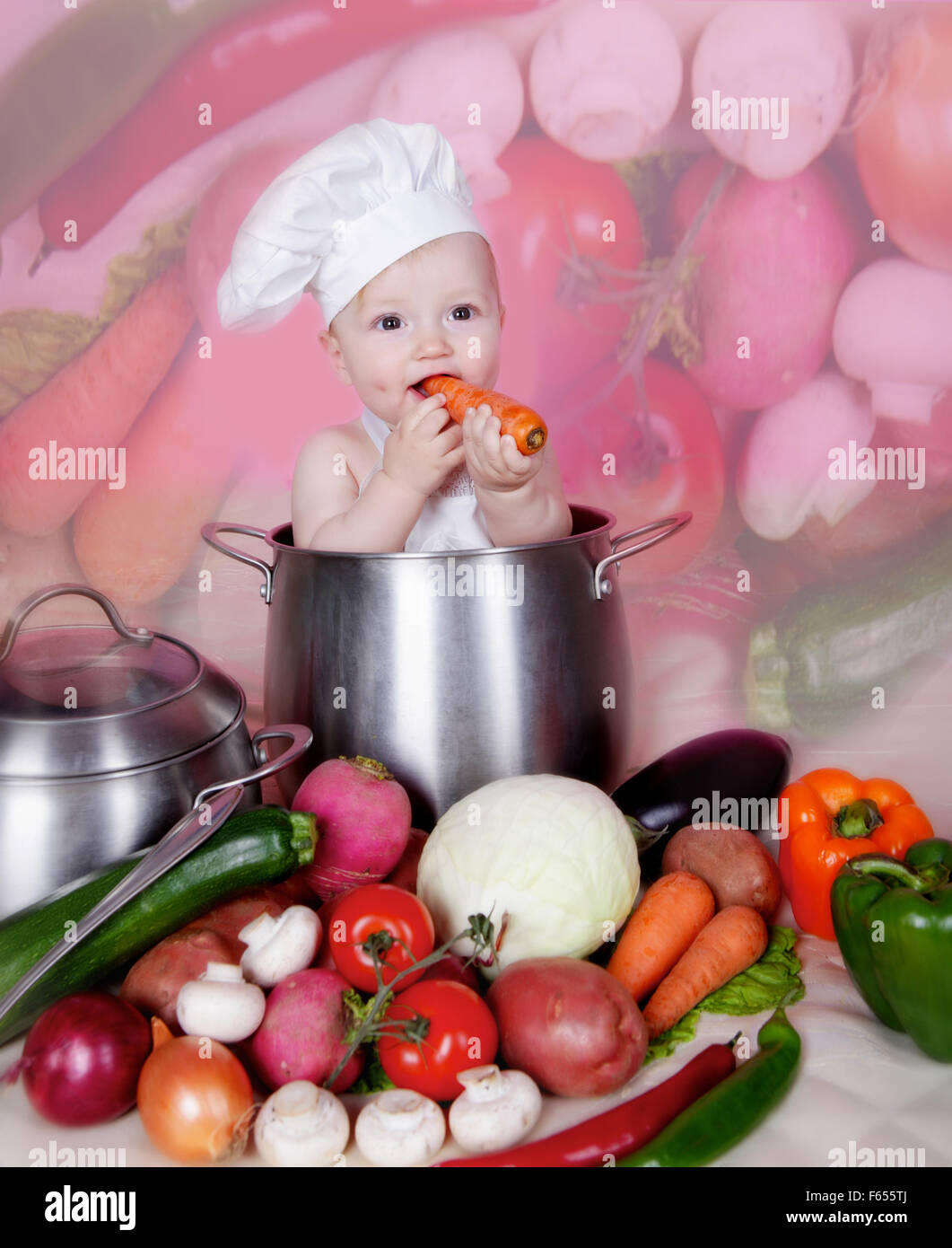 Baby cook in saucepan Stock Photo - Alamy