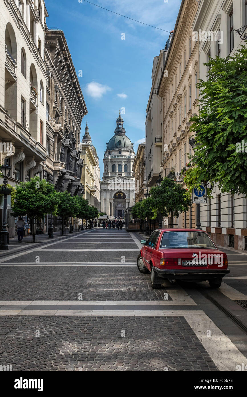 Street life in Budapest Hungary with St. Stephen's Cathedral in the ...