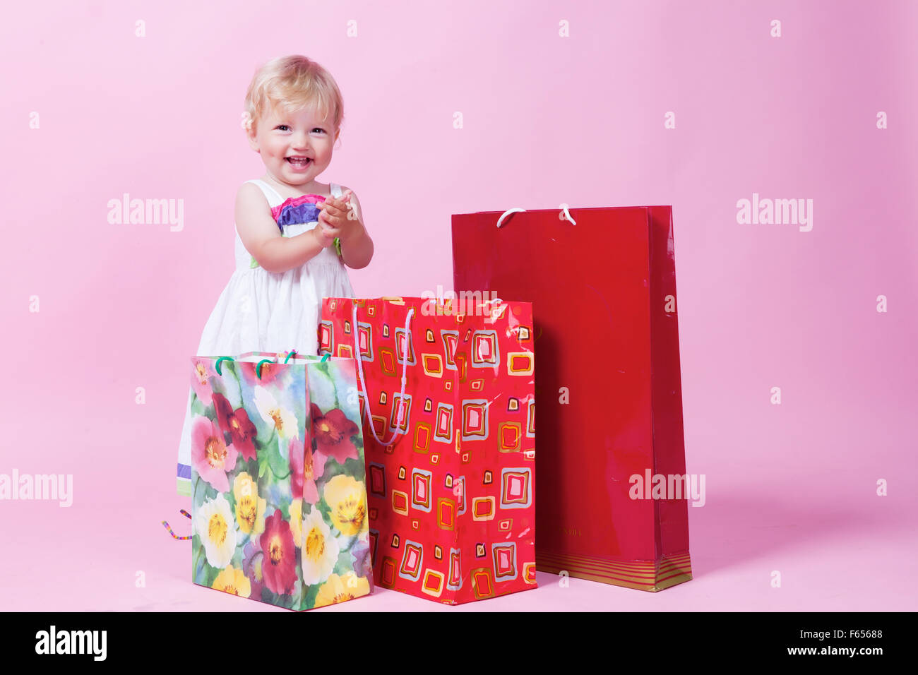 Girl with packages Stock Photo - Alamy