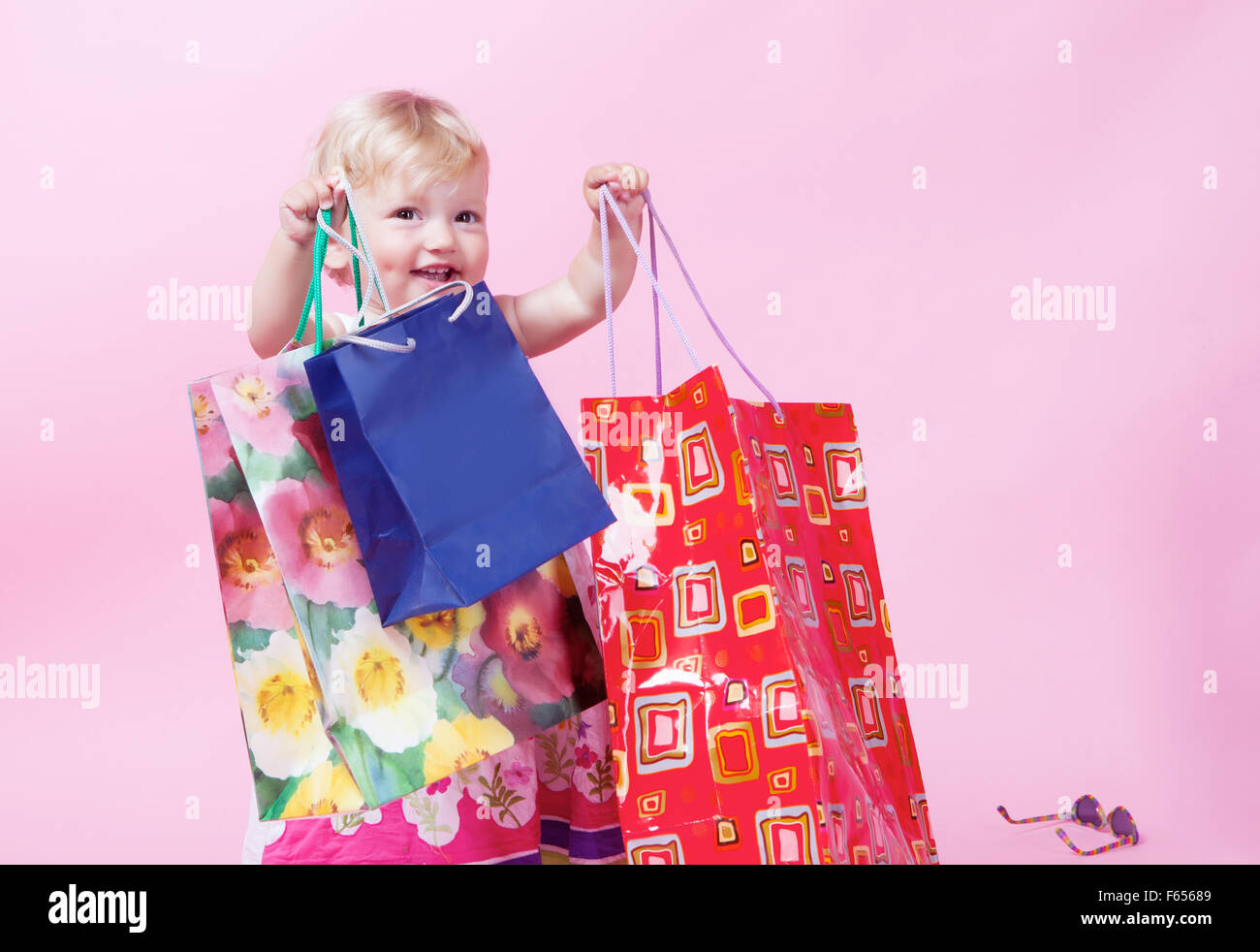 Girl with packages Stock Photo - Alamy
