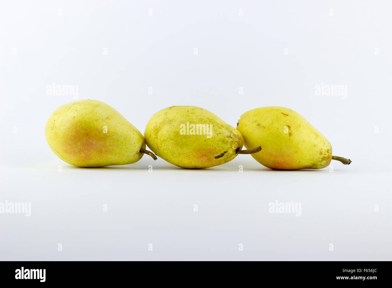 Three pears, isolated on a white background Stock Photo - Alamy
