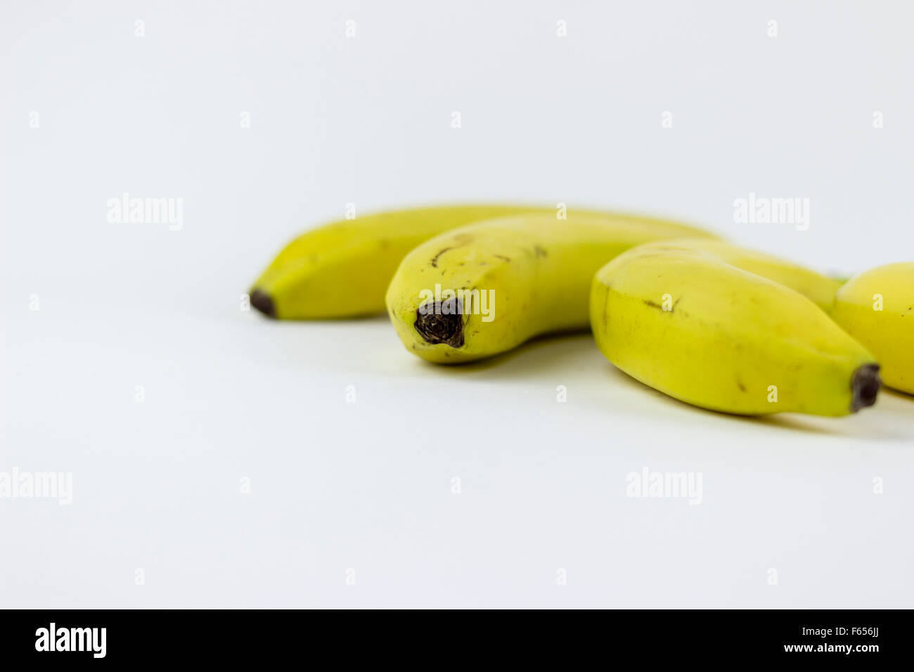 Three bananas, isolated on a white background Stock Photo - Alamy