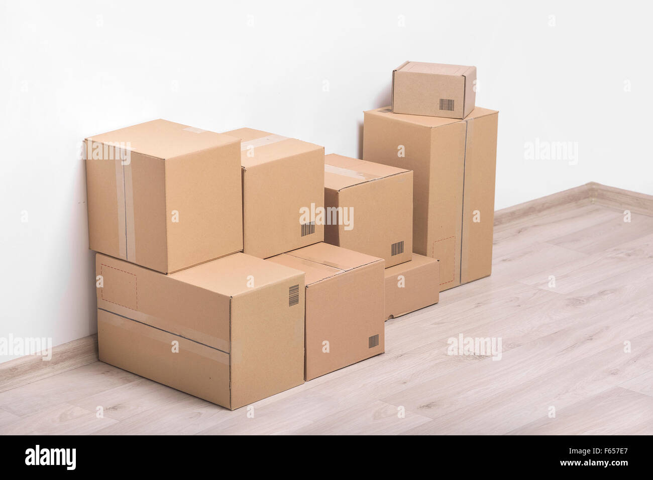 Moving boxes on the floor Stock Photo - Alamy