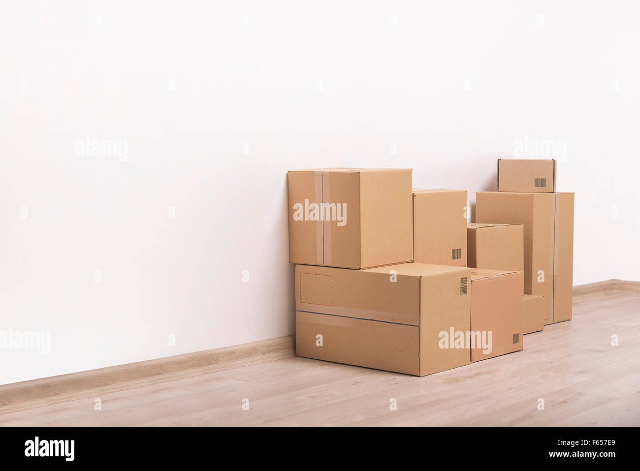 Moving boxes on the floor Stock Photo - Alamy