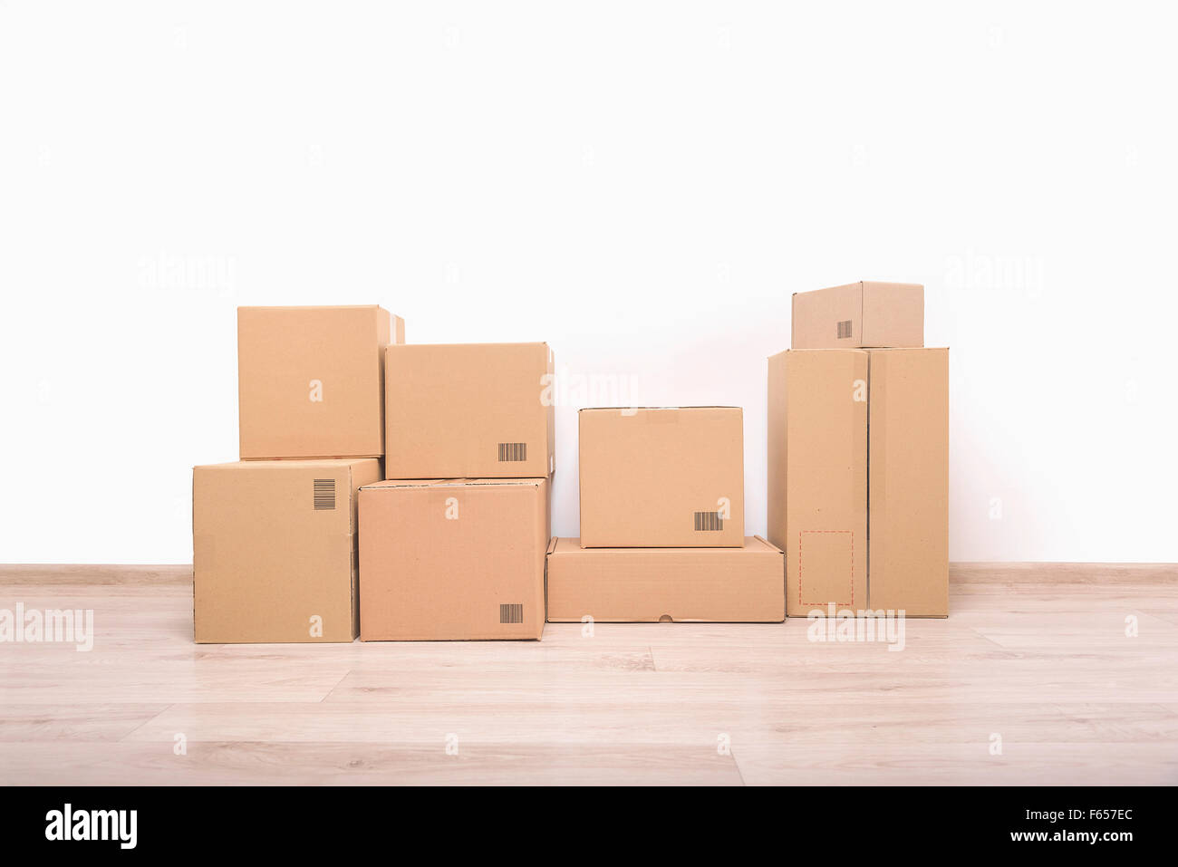 Moving boxes on the floor Stock Photo - Alamy