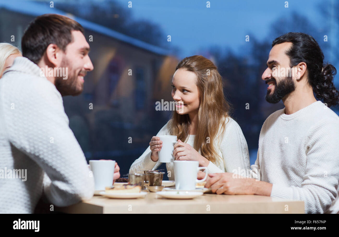 happy friends meeting and drinking tea or coffee Stock Photo - Alamy