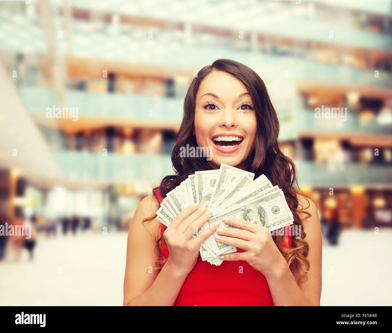 woman in red dress with us dollar money Stock Photo - Alamy
