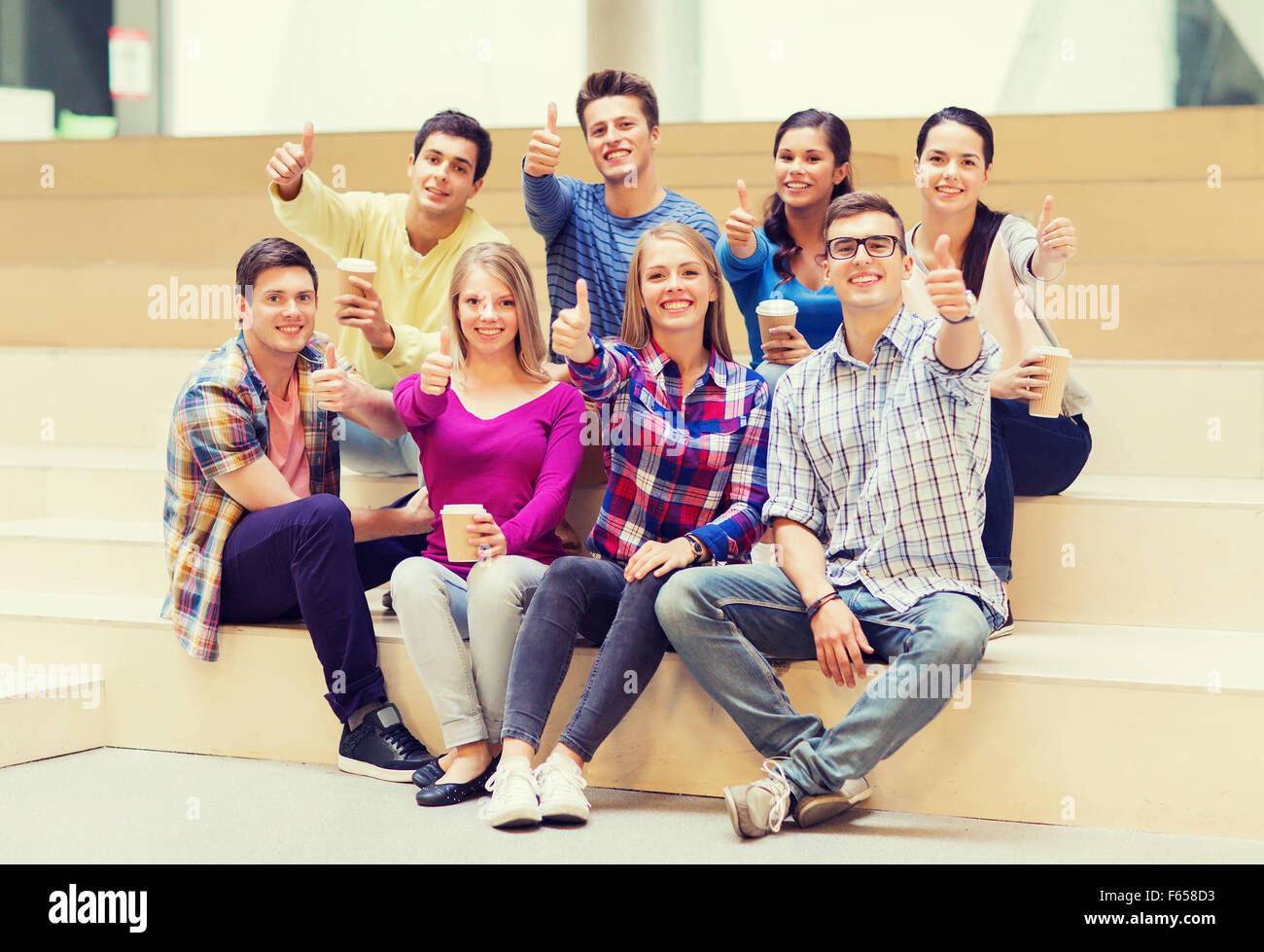 group of smiling students with paper coffee cups Stock Photo - Alamy