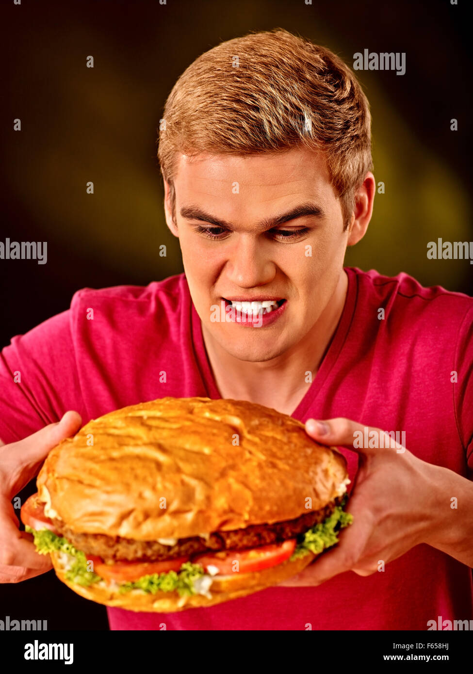 Man eating big sandwich Stock Photo - Alamy