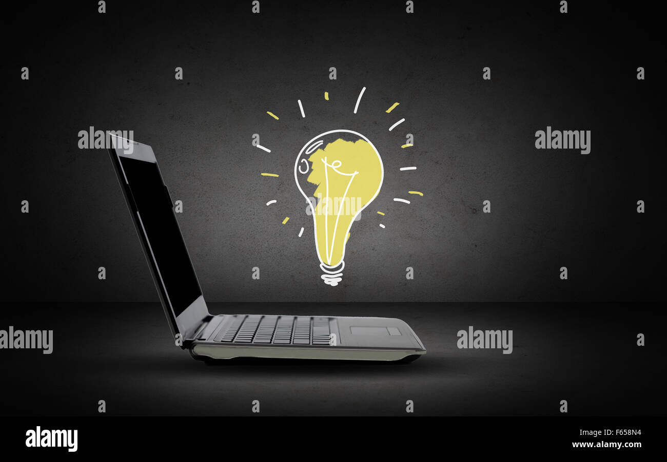 open laptop computer with lighting bulb doodle Stock Photo - Alamy