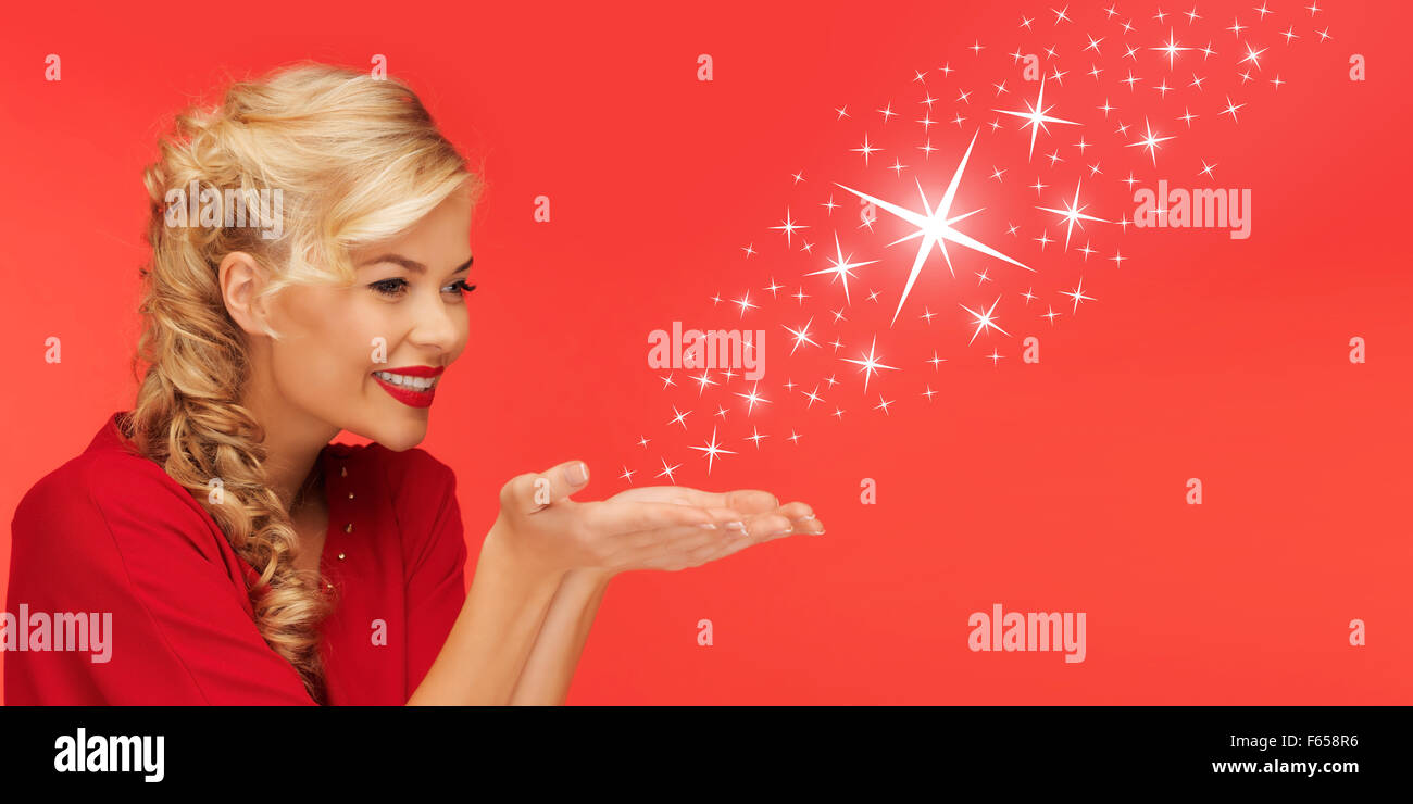 woman sending stars from palms of her hands Stock Photo - Alamy