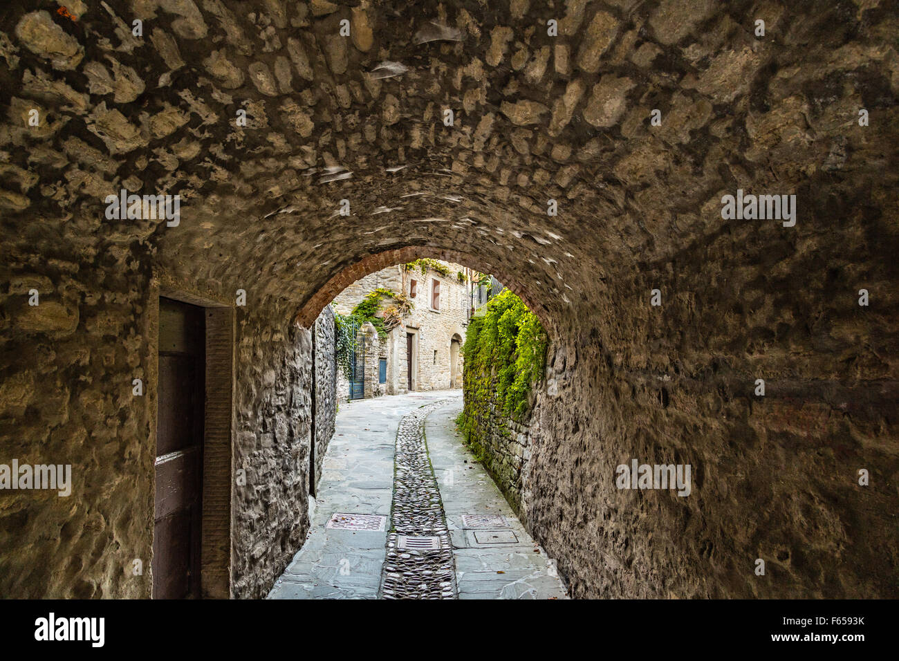 Alleys in medieval mountain village in Tuscany characterized by houses ...