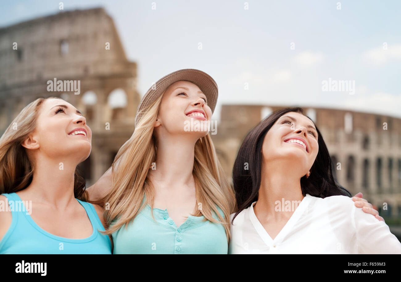 group of happy young women over coliseum Stock Photo - Alamy
