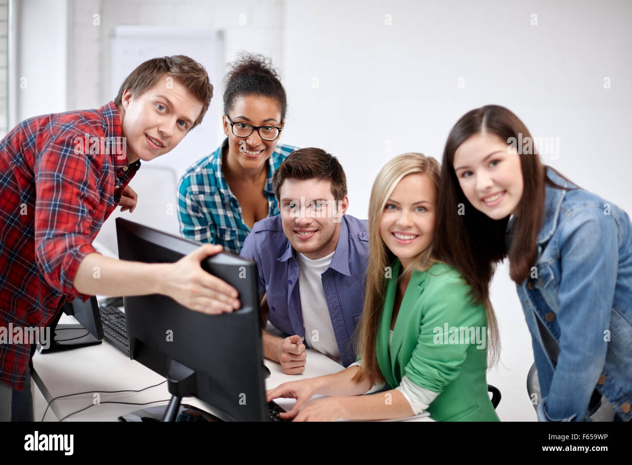 happy high school students in computer class Stock Photo - Alamy