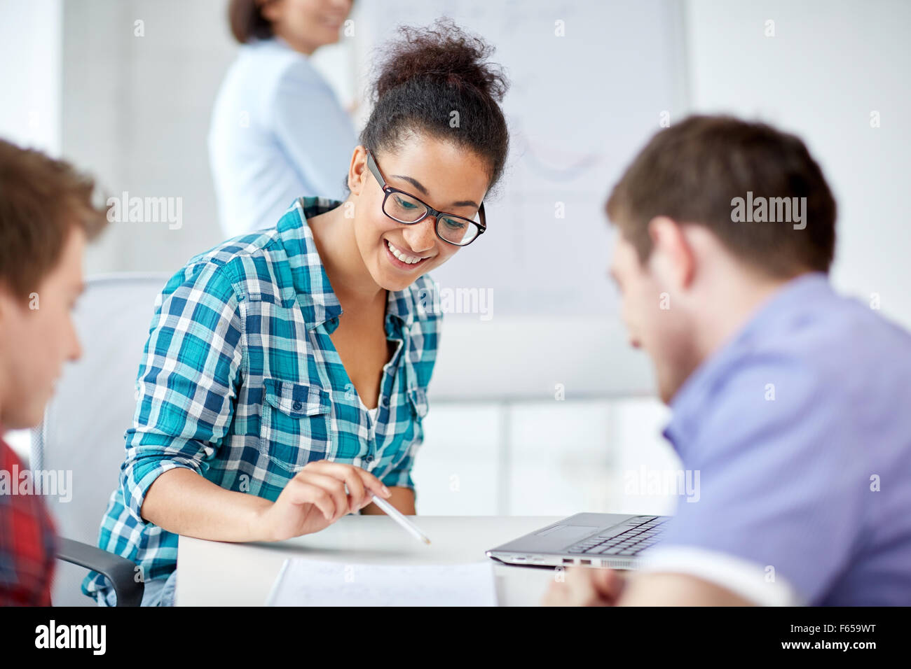 group of happy high school students with workbook Stock Photo - Alamy