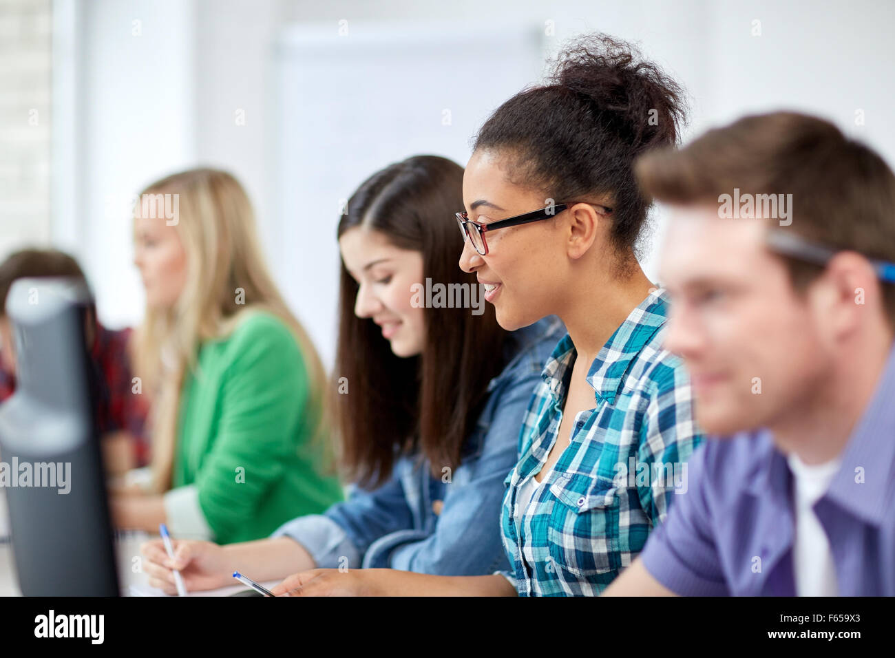 happy high school students in computer class Stock Photo - Alamy
