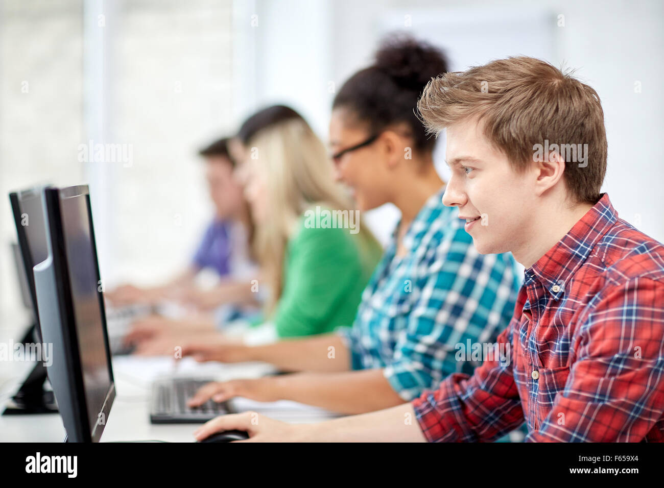 happy high school students in computer class Stock Photo - Alamy