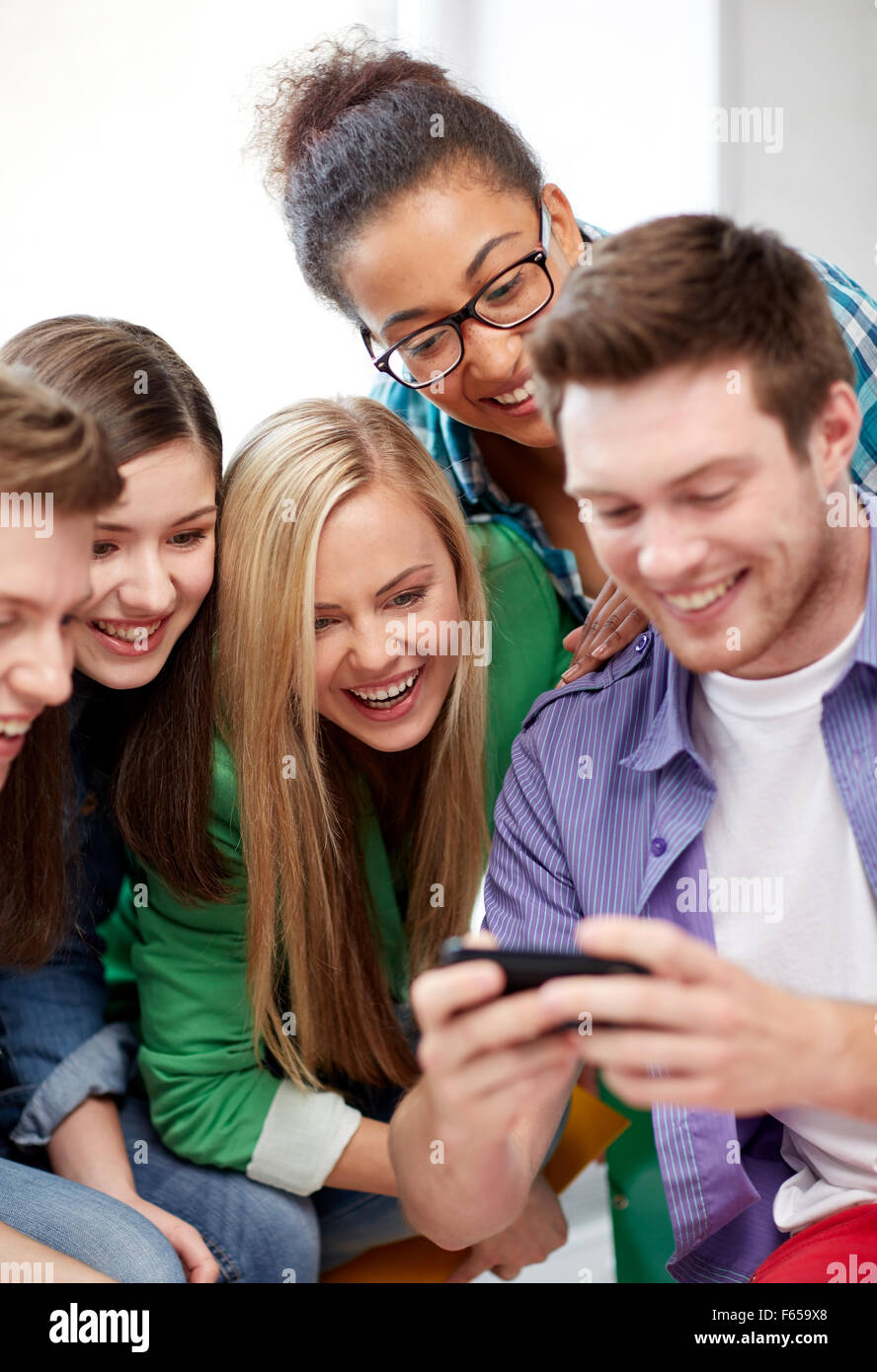 group of happy students with smartphone at school Stock Photo - Alamy