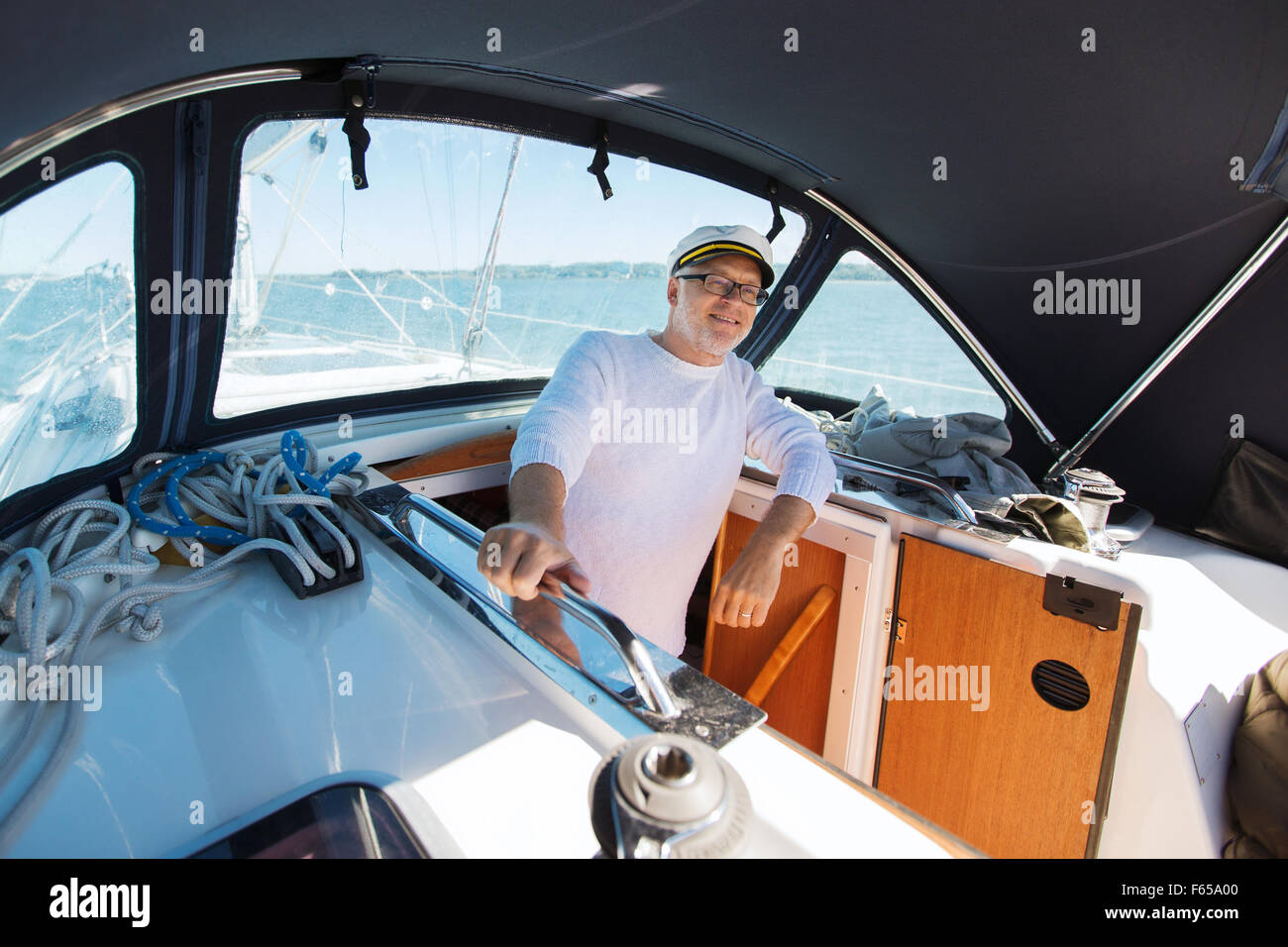 happy senior man on boat or yacht sailing in sea Stock Photo - Alamy