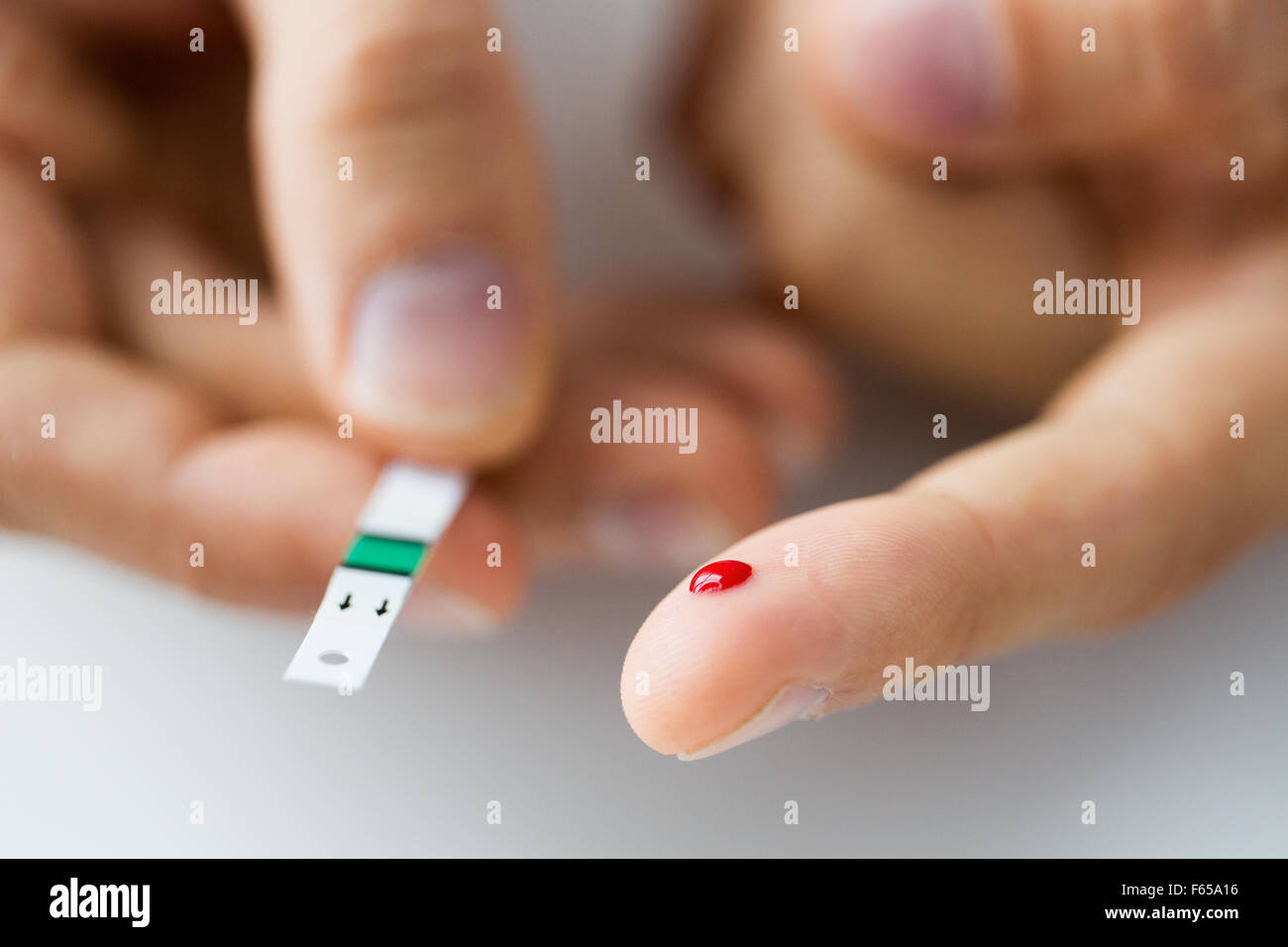 Blood glucose monitor finger hi-res stock photography and images - Alamy