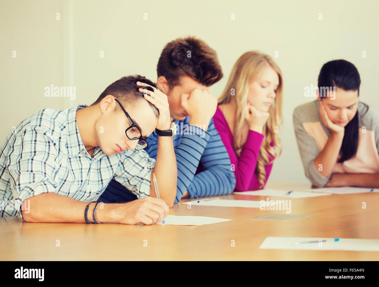 group of students with papers Stock Photo - Alamy