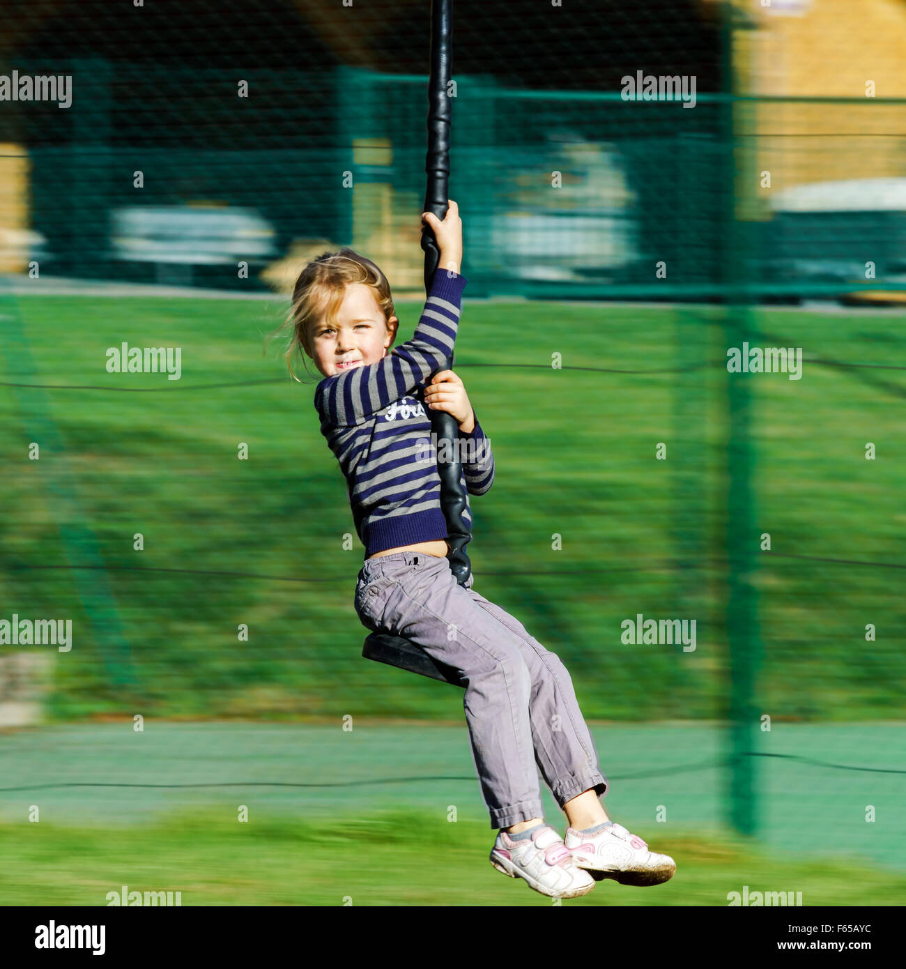 Cute girl playing on the playground, sunny day, childhood concept Stock ...