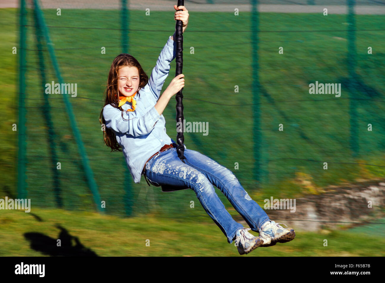Cute girl playing on the playground, sunny day, childhood concept Stock ...