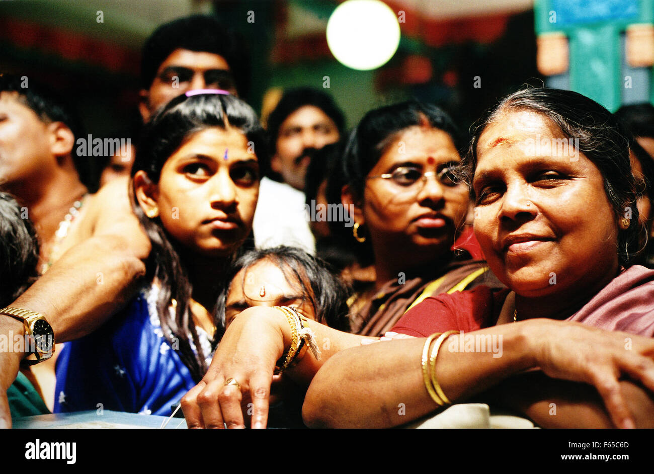 Hindu women standing in temple Stock Photo - Alamy